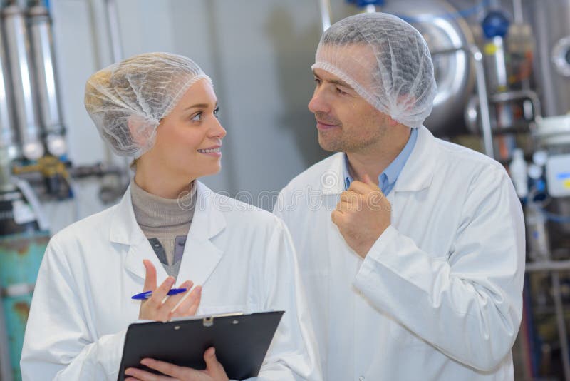 Workers in Uniform Testing Dairy Production Process Stock Image - Image ...