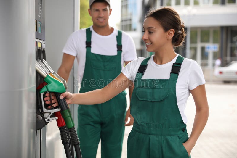 Workers in Uniforms at Modern Gas Station Stock Image - Image of diesel ...