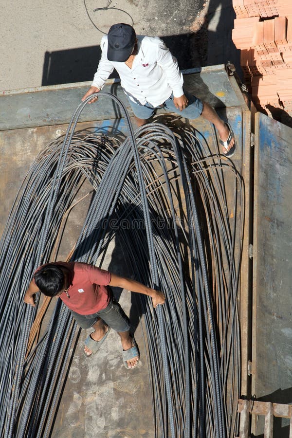 Workers Unload Construction Material Editorial Image - Image of bars ...