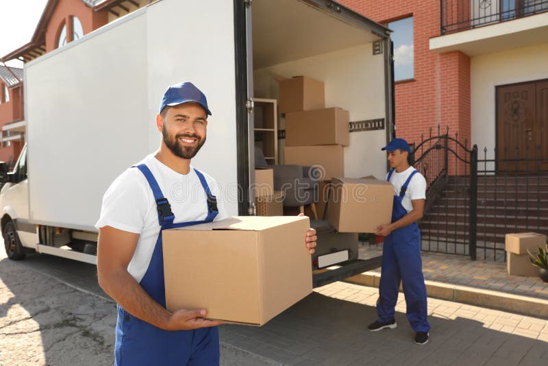 Workers Unloading Boxes from Van Outdoors. Moving Service Stock Photo ...