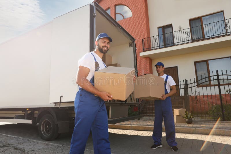 Workers Unloading Boxes from Van Outdoors. Moving Service Stock Photo ...