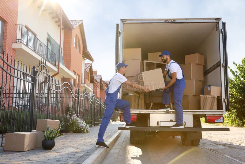 Workers Unloading Boxes from Van. Moving Service Stock Photo - Image of ...
