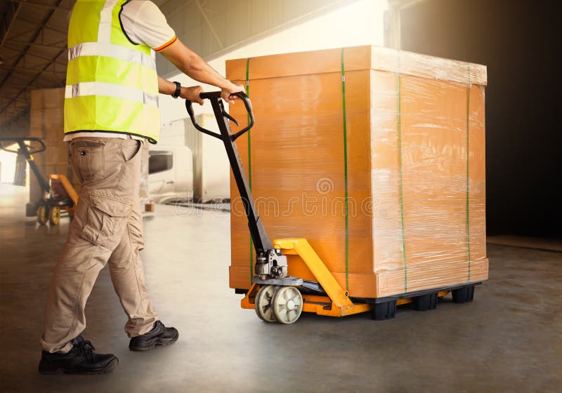Workers Unloading Heavy Package Boxes into Container Truck. Shipping ...