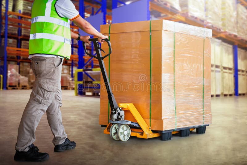 Workers Unloading Packaging Boxes on Pallets in Warehouse. Cartons ...