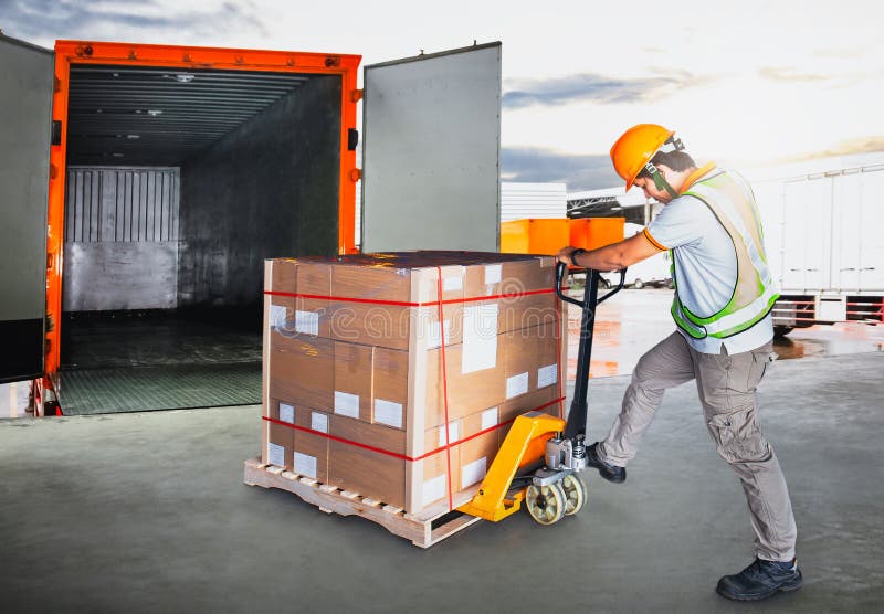 Workers Unloading Package Boxes into Container Truck. Warehouse ...