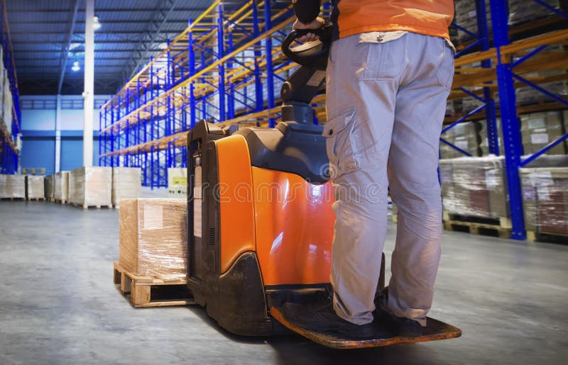 Workers Unloading Package Boxes on Pallets in Storage Warehouse ...