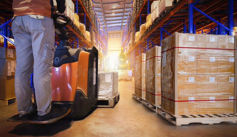 Workers Unloading Package Boxes on Pallets in Warehouse. Supply Chain ...