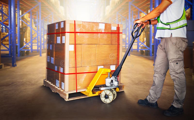 Workers Unloading Package Boxes on Pallets in Storage Warehouse ...
