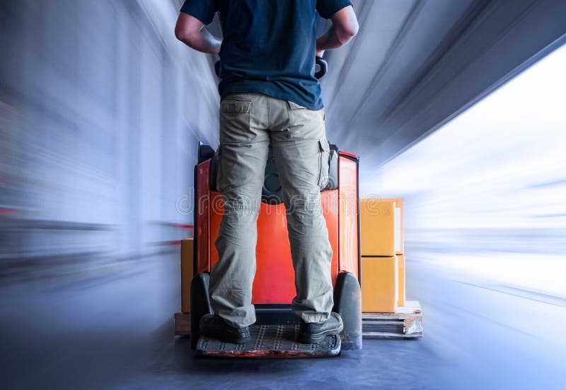 Workers Unloading a Package Boxes on in Warehouse. Supply Chain ...