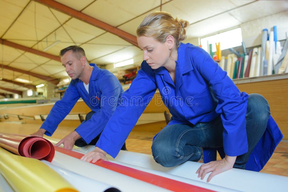 Workers Unrolling Paper Sheets Stock Photo - Image of handsome, unroll ...