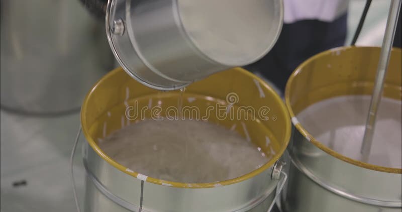 Preparation of Polymer Material before Application. Workers Use Mixers ...