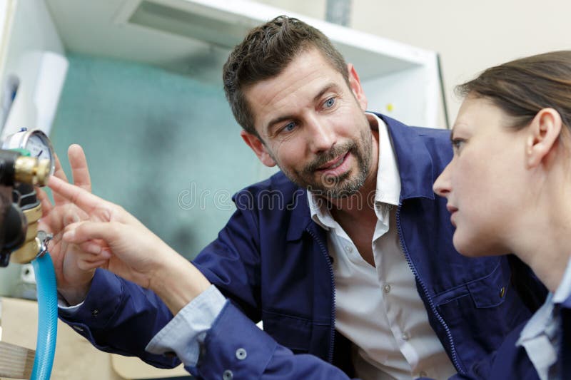 Workers Using Analogue Positive Pressure Gauge Stock Image - Image of ...