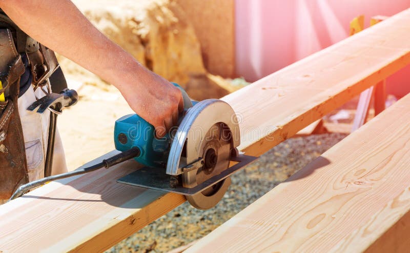 Workers Using Chainsaw Cutting and Sawing Industrial Construction Wood ...