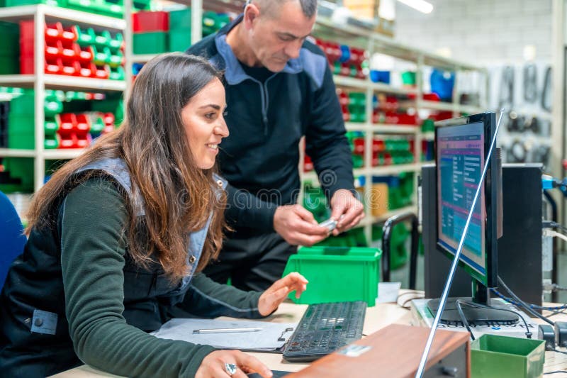 Workers Using Computer To Do Inventory in a Logistic Center Stock Photo ...