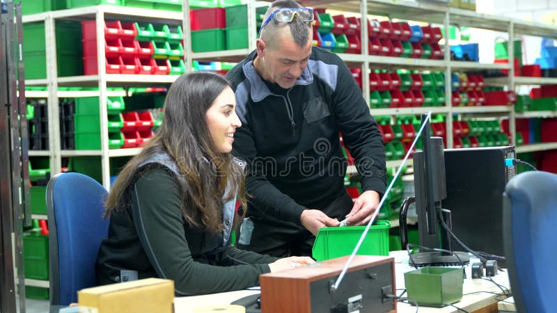 Workers Using Computer To Do Inventory in a Logistic Center Stock ...