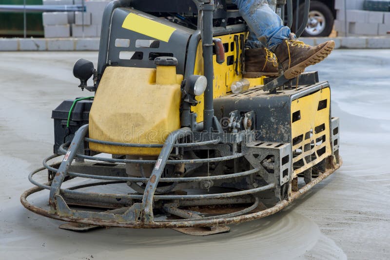 Workers are Using Concrete Polishing Machines for Cement after Pouring ...