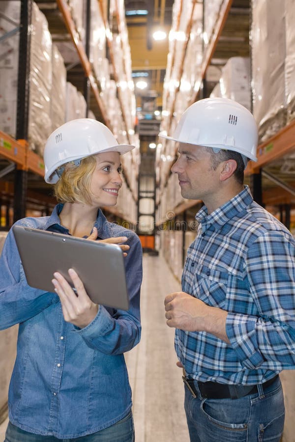 Workers Using Digital Tablet in Warehouse Stock Photo - Image of front ...