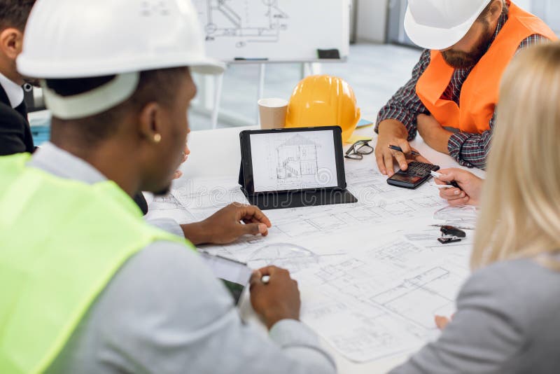 Workers Using Gadgets for Creating Plan of Construction Stock Photo ...