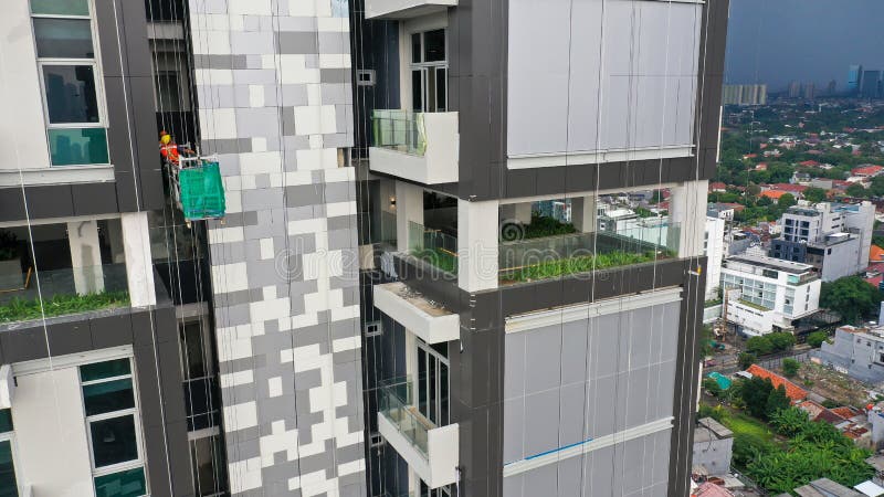 Workers are Using Gondola As Vertical Trasport To Install Aluminum ...