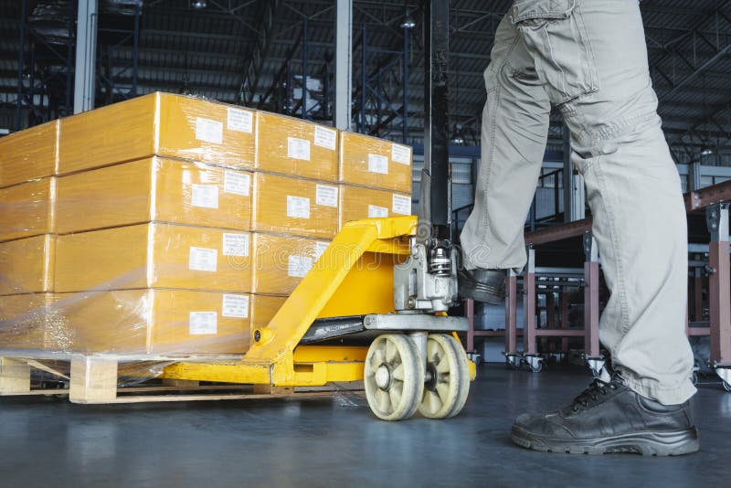 Workers Using Hand Pallet Jack Unloading Packaging Boxes on Pallet ...