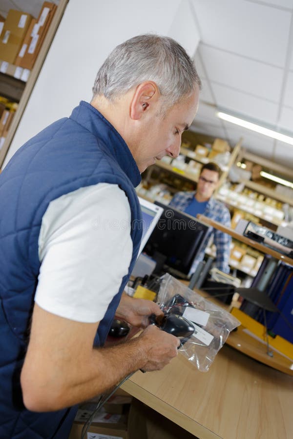 Workers Using Scanner in Store Counter Stock Image - Image of counter ...
