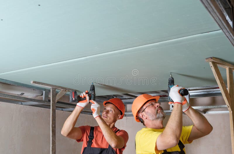 Installation of Ceiling Drywall Stock Photo - Image of hand, fastens ...