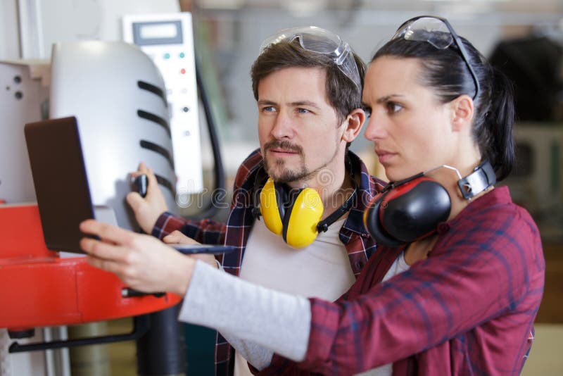 Workers Using Tablet by Factory Machinery Stock Image - Image of woman ...