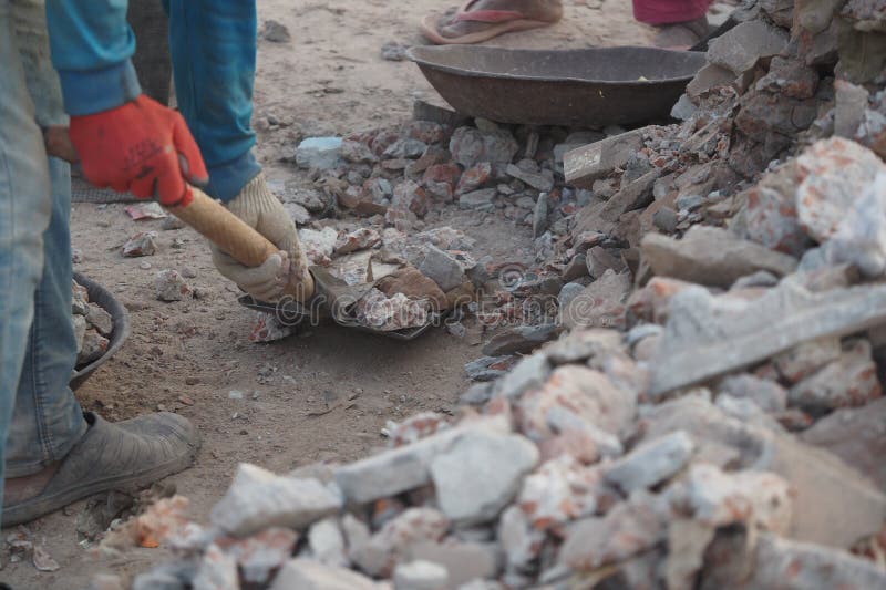 Construction Workers Clearing Debris from a Building Site Stock Image ...