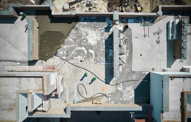 Workers Walking Down Apartment Building at Construction Site. Stock ...