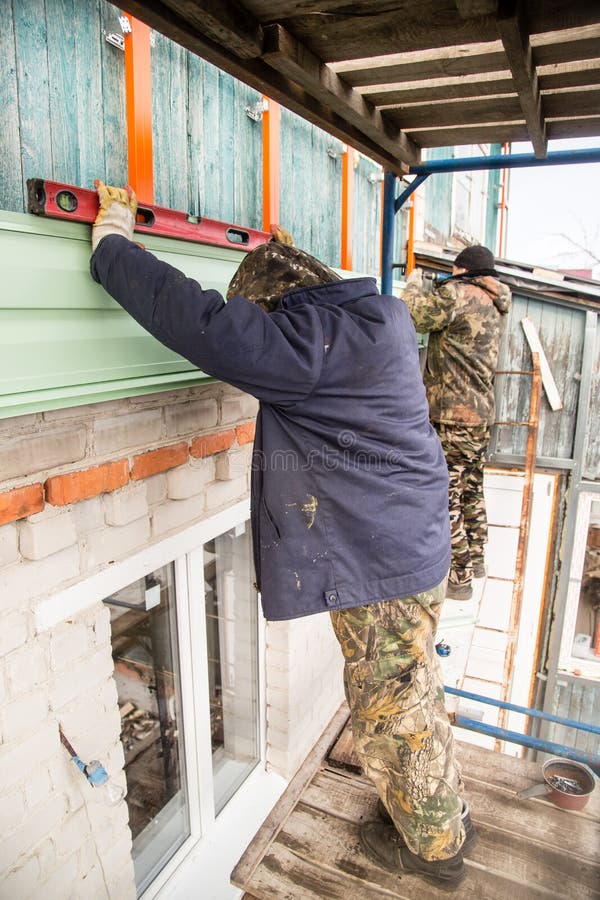 Workers Walling the House with Wall Siding Editorial Stock Image ...