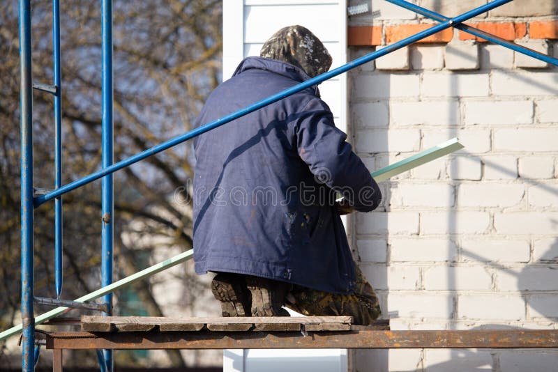 Workers Walling the House with Wall Siding Stock Photo - Image of ...