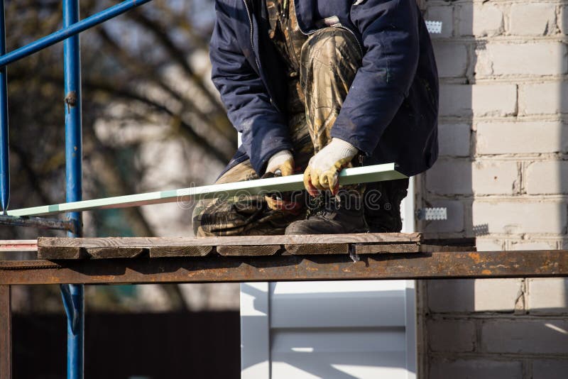 Workers Walling the House with Wall Siding Stock Photo - Image of ...
