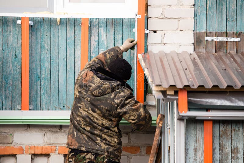 Workers Walling the House with Wall Siding Stock Photo - Image of ...