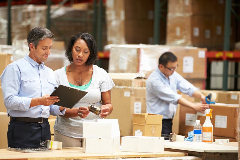 Workers in Warehouse Preparing Goods for Dispatch Stock Image - Image ...