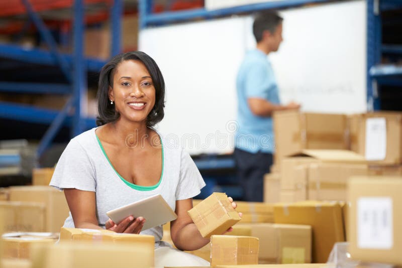 Workers In Warehouse Preparing Goods For Dispatch Stock Photo - Image ...