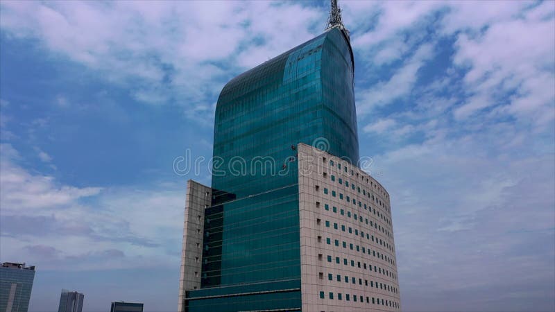 Workers Washing Windows of the Modern Turquoise Blue Skyscraper ...