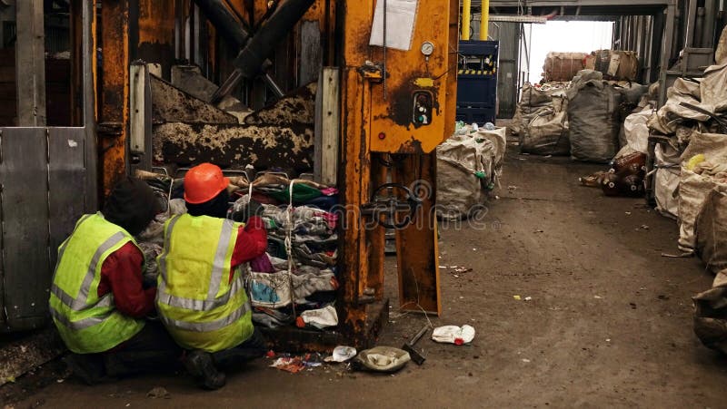 Workers at the Waste Processing Plant. Sorting Trash on a Conveyor Belt ...