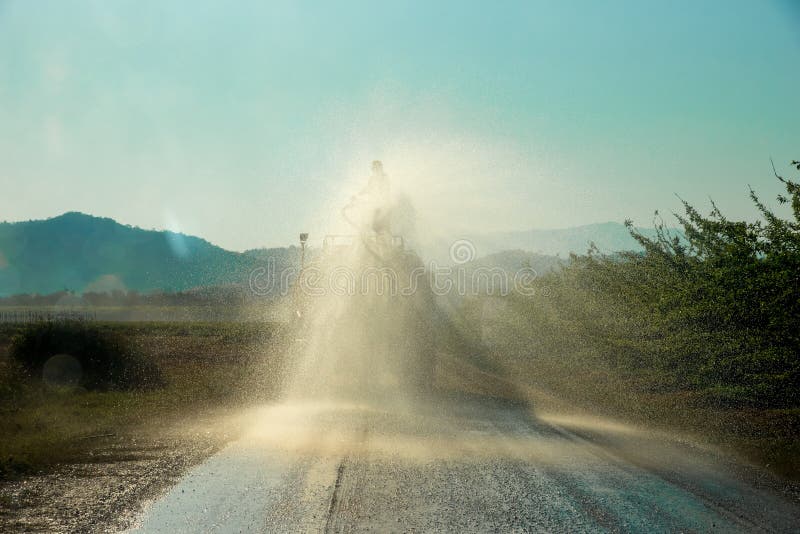 Workers on Water Truck are Spraying Water on the Road To Keep Dust Out ...