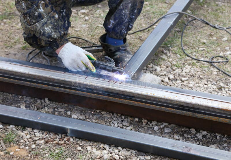 Workers Weld Metal for Sliding Gates. Stock Image - Image of electrodes ...