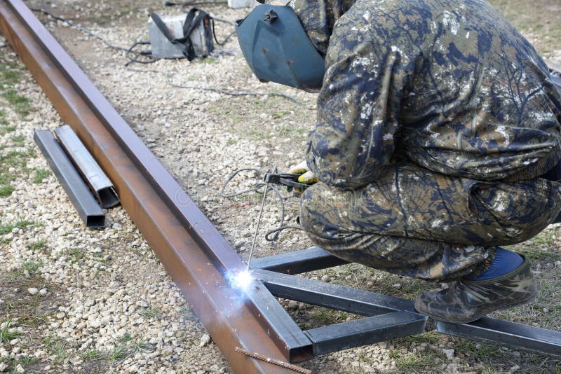 Workers Weld Metal for Sliding Gates. Stock Image - Image of welder ...