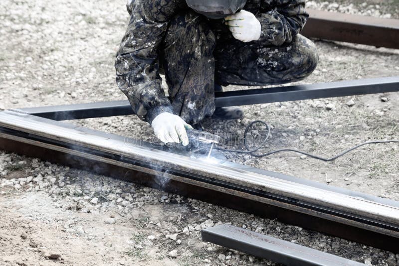 Workers Weld Metal for Sliding Gates. Stock Photo - Image of rack ...