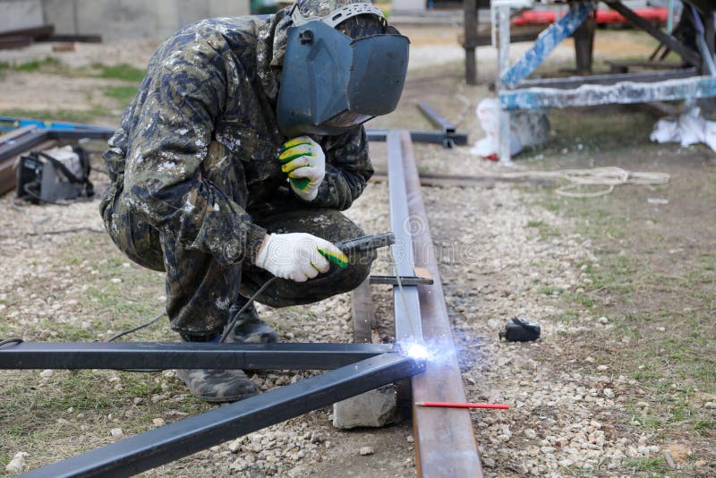 Workers Weld Metal for Sliding Gates. Stock Photo - Image of sparks ...