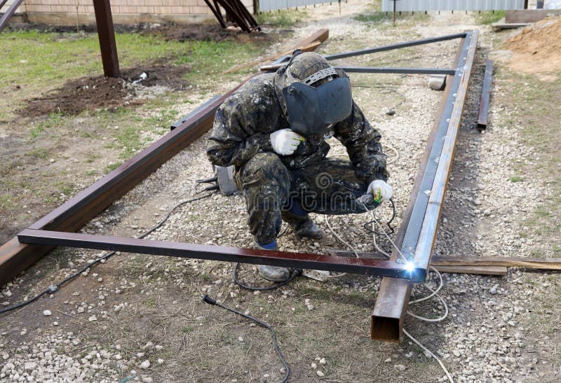 Workers Weld Metal for Sliding Gates. Stock Image - Image of work ...
