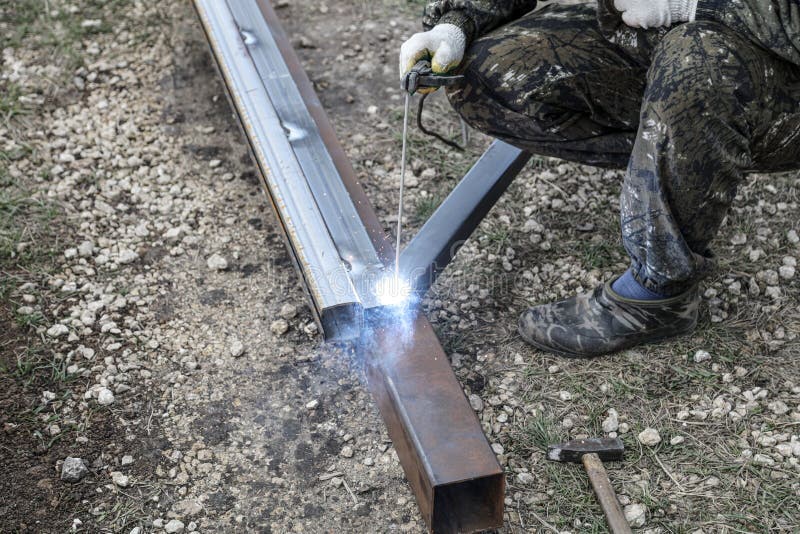 Workers Weld Metal for Sliding Gates. Stock Photo - Image of driveway ...