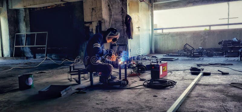 Workers Welding Iron in a Workshop. Stock Photo - Image of metal ...