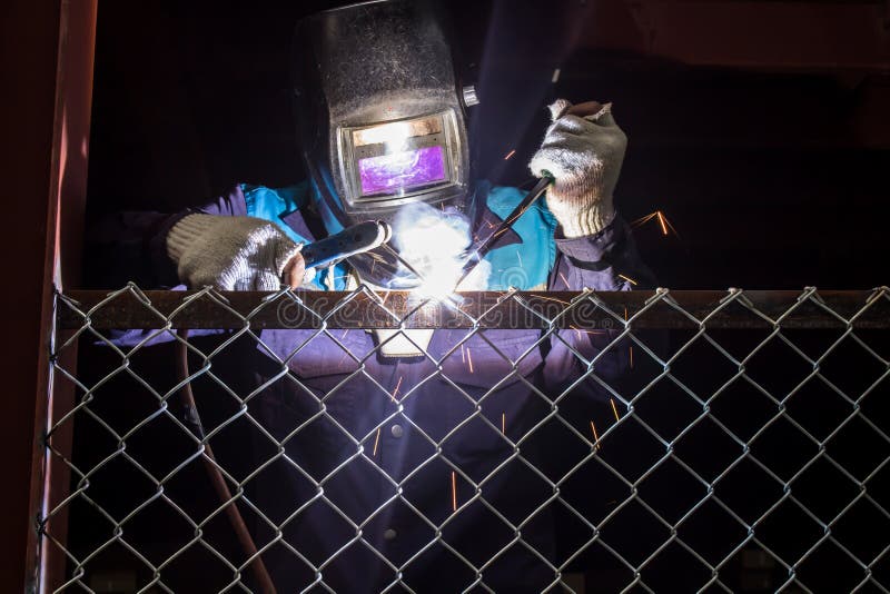 Workers are Welding Steel Mesh in the Work Area. Stock Photo - Image of ...