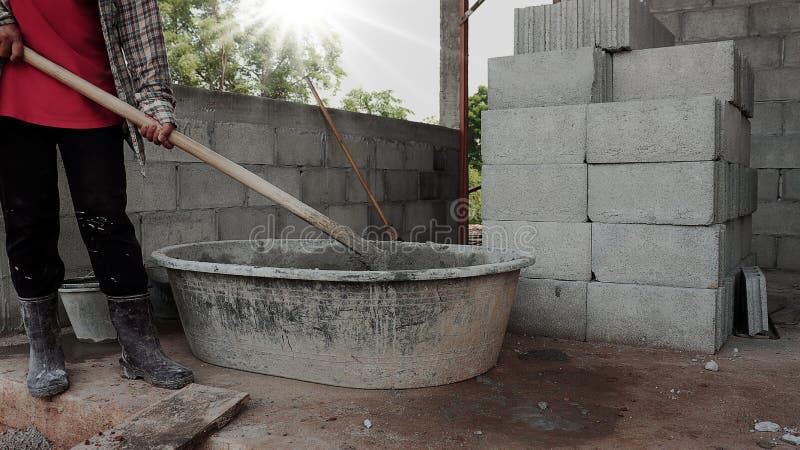 Labor is Mixing Cemen, Water, Sand Together for Construction Sit Stock ...