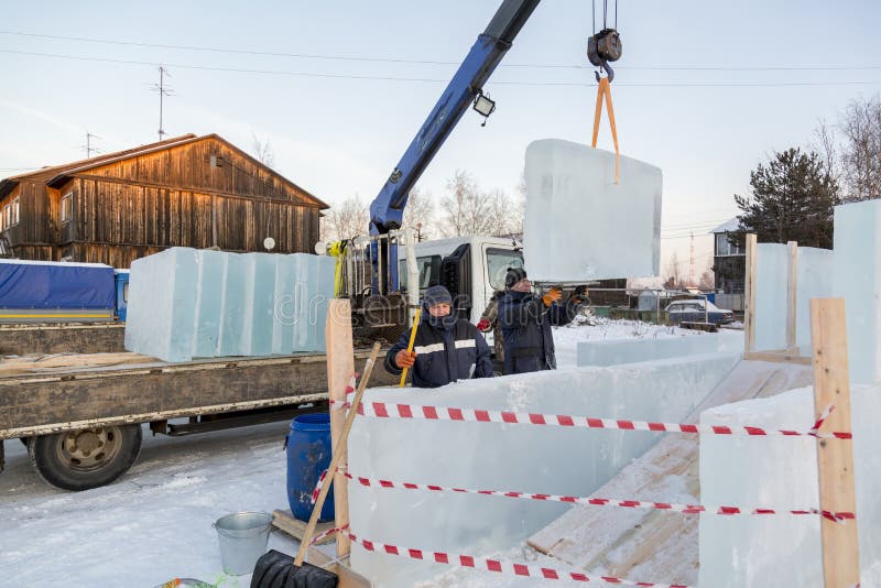 Workers in Winter Workwear Installing Ice Panels Stock Image - Image of ...