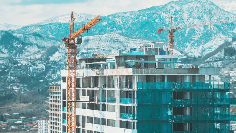 Workers Work in a Construction Area, during the Construction of a High ...