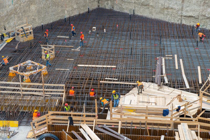 Workers at Work for the Construction of the Reinforced Concrete Base ...
